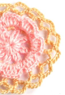 Round crochet motif with flower in center with stitch scheme ...